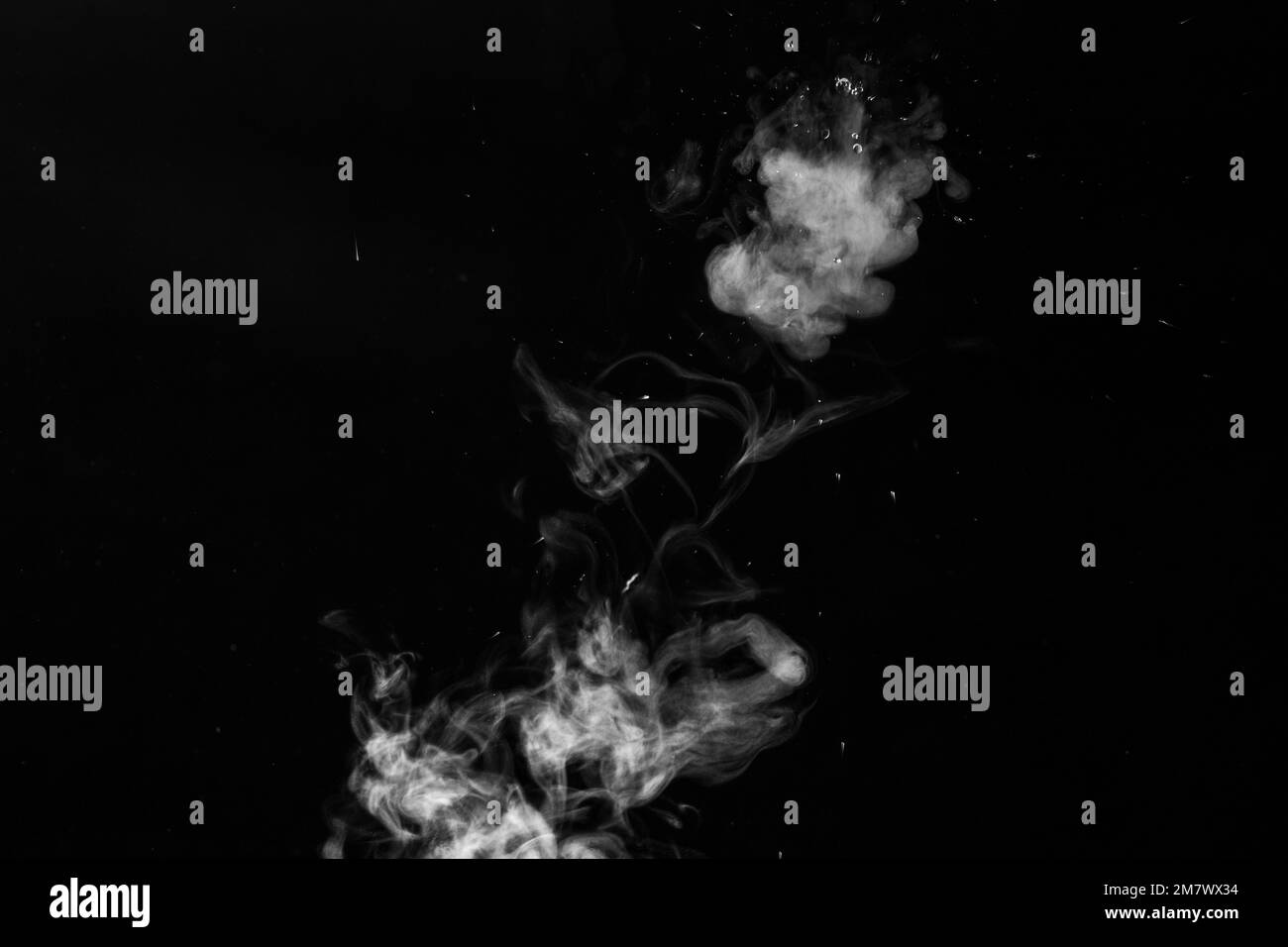 A jet of white water vapor with splashes of water from the humidifier ...
