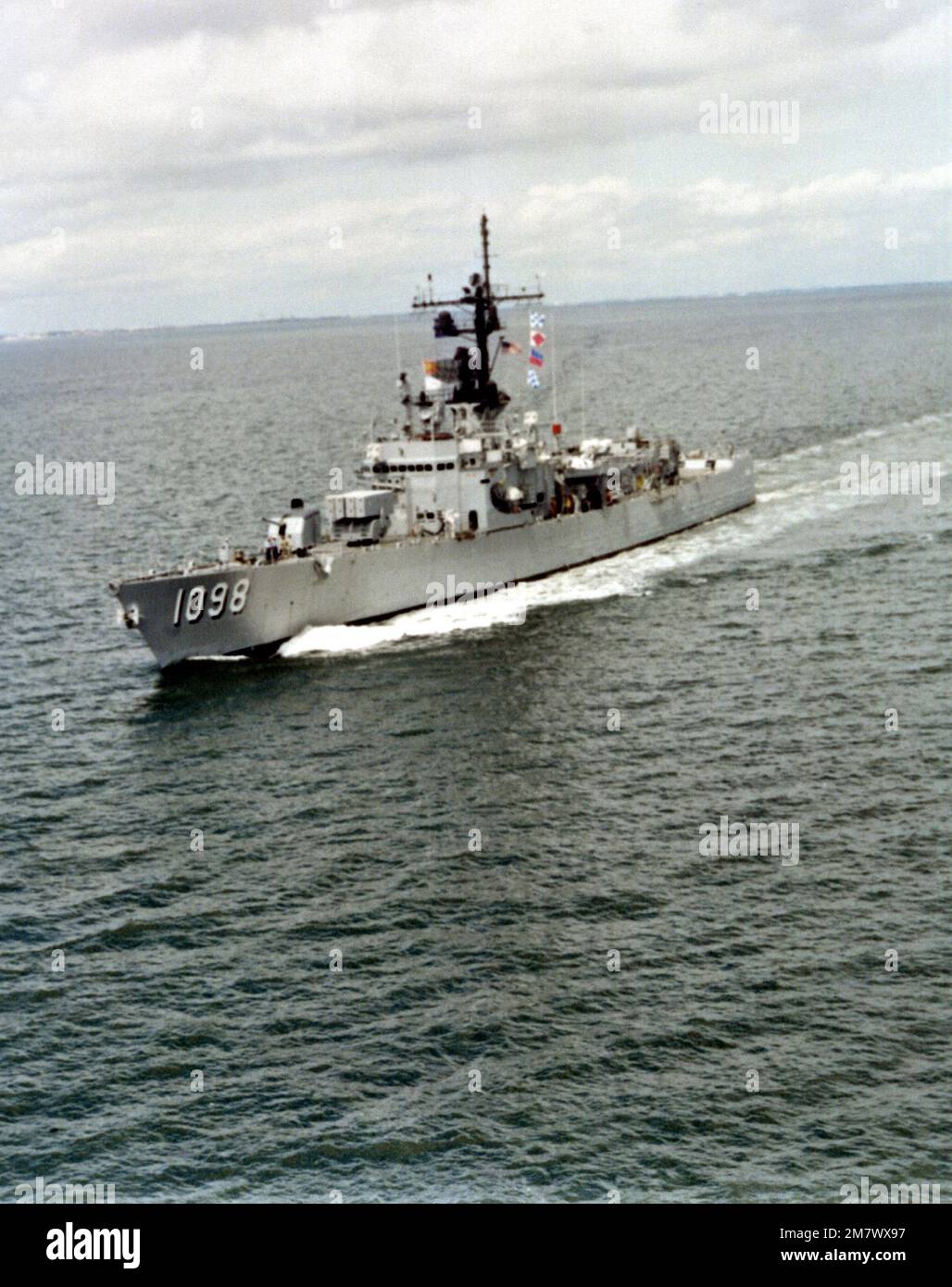 An aerial port bow view of the frigate USS Glover (FF-1098) underway ...