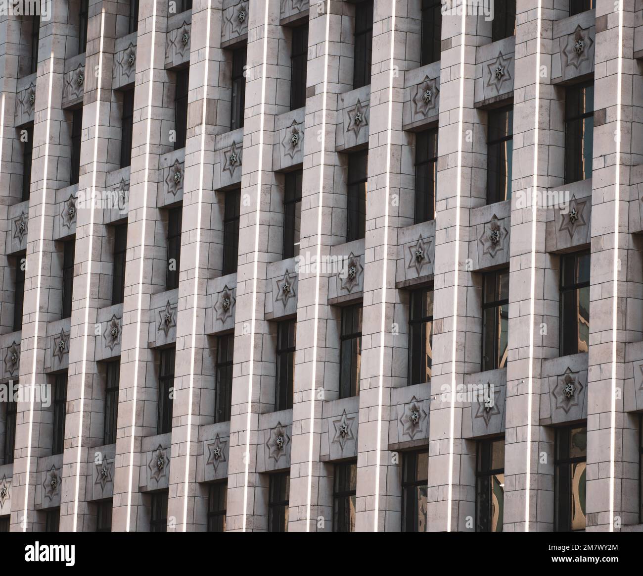 The exterior of a building with a lot of windows Stock Photo - Alamy