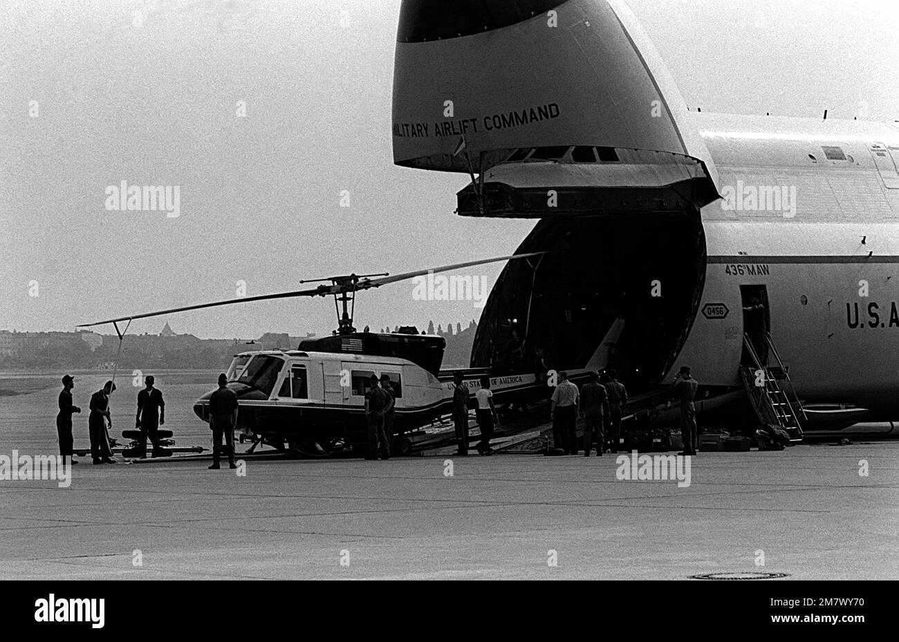 A UH-1 Iroquois presidential helicopter is offloaded from a C-5 Galaxy ...