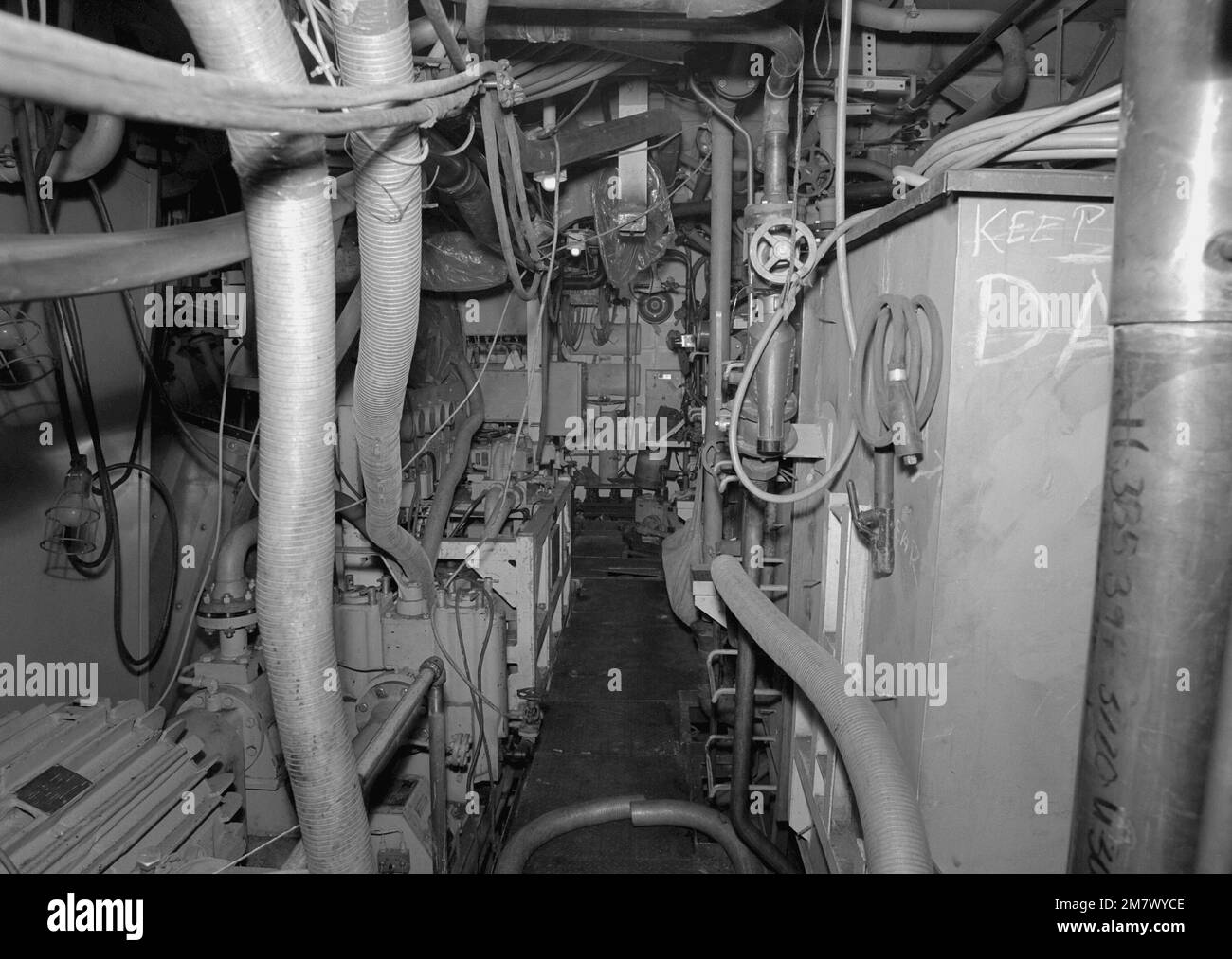 The lower level engine room aboard the guided missile frigate DOYLE ...