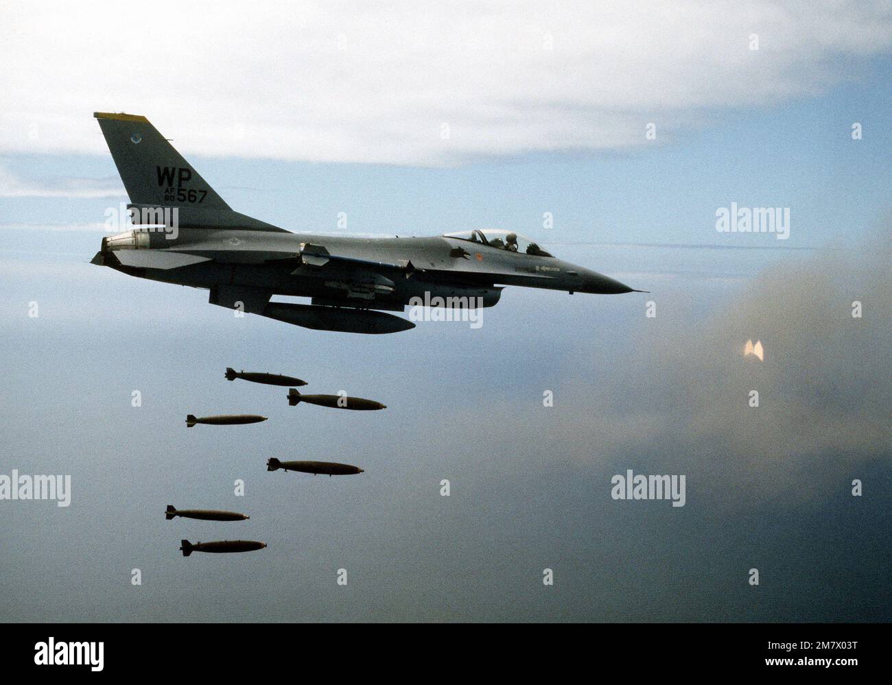 A right side air-to-air view of an F-16A Fighting Falcon aircraft from ...