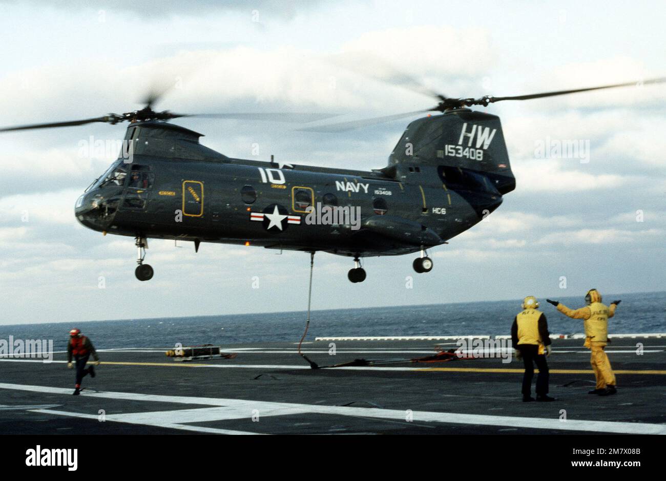 A UH-46D Sea Knight helicopter from Helicopter Combat Support Squadron 6 (HC-6) hovers above the ...