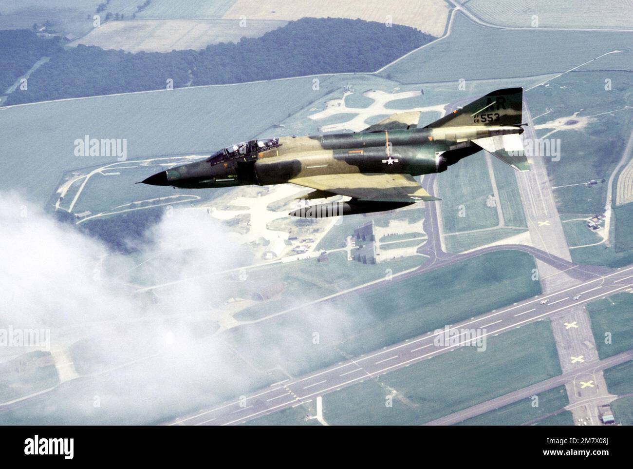 An air-to-air left side view of an RF-4C Phantom II aircraft in flight ...