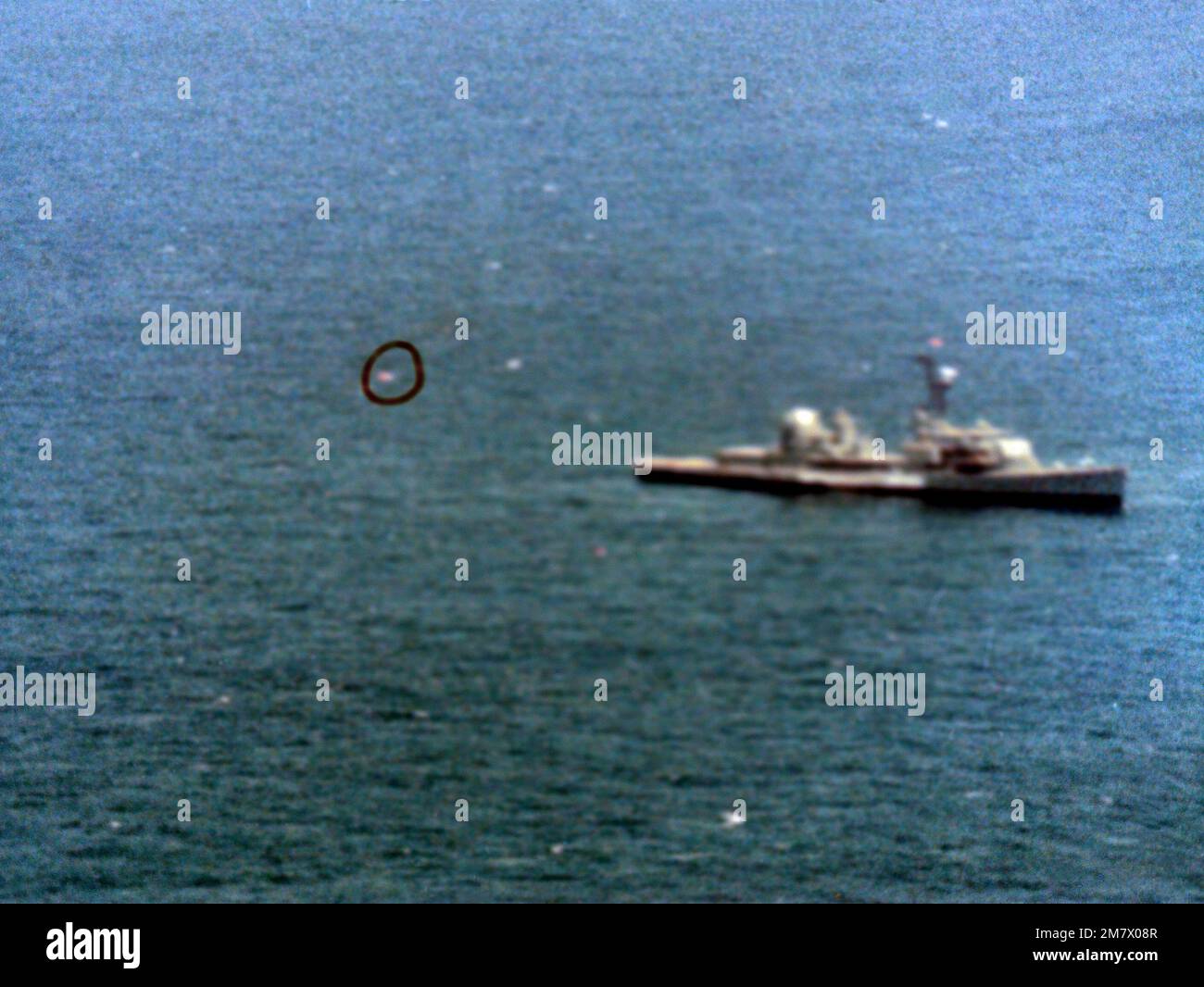 An aerial view of a Tomahawk cruise missile approaching the starboard ...