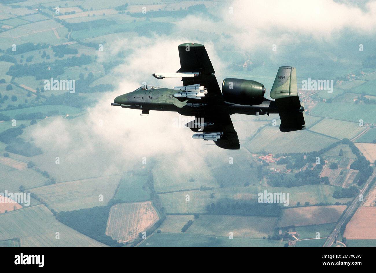 An air-to-air left side view of an A-10 Thunderbolt II aircraft banking ...