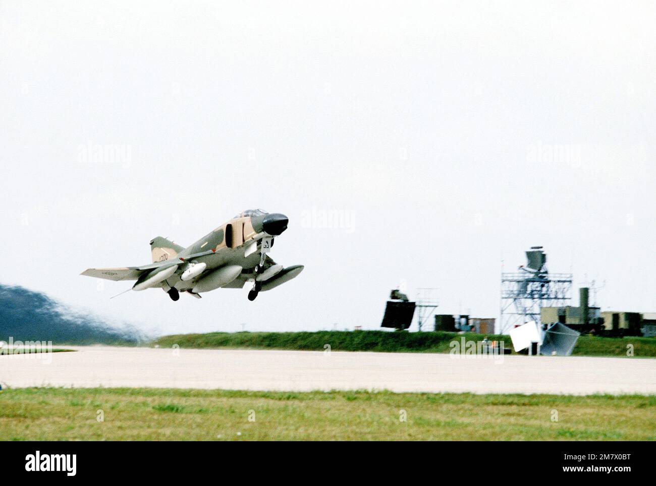 An F-4D Phantom II aircraft takes off, ending its assignment with the ...