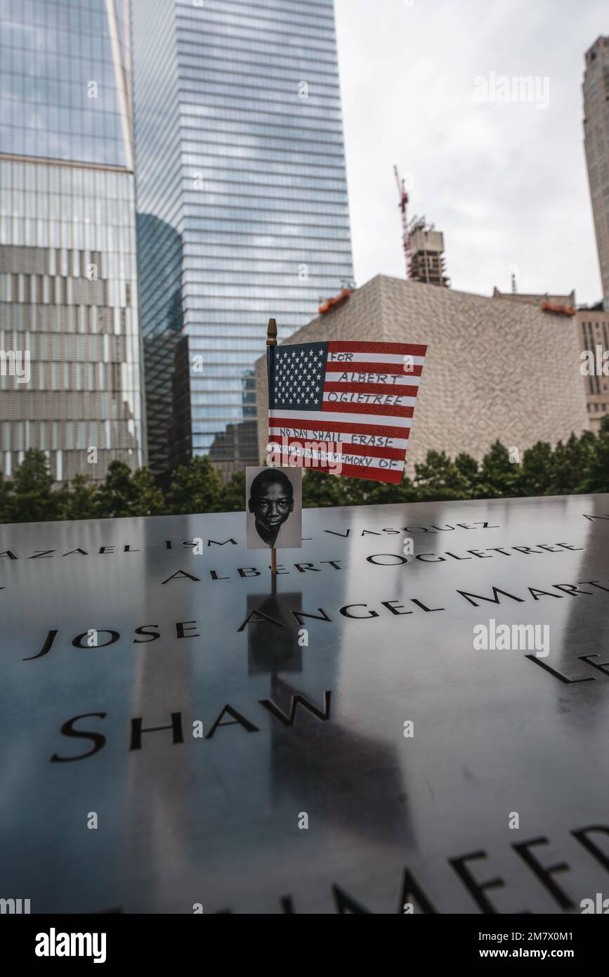A vertical shot of the USA flag with a picture of Albert Ogletree at ...