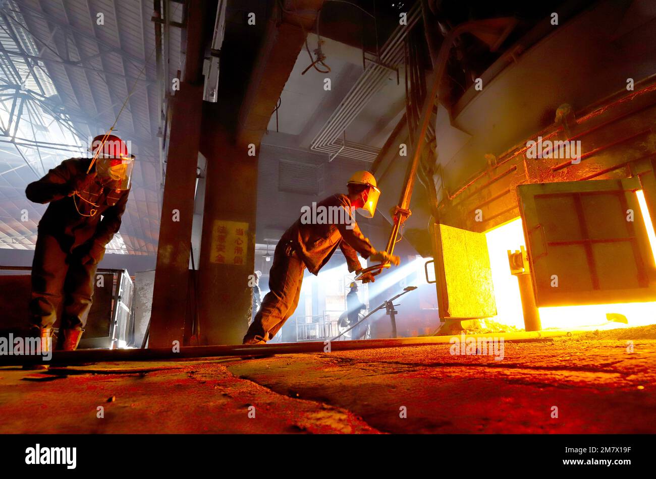 ZHANGYE, CHINA - JANUARY 10, 2023 - A smelting worker observes the ...