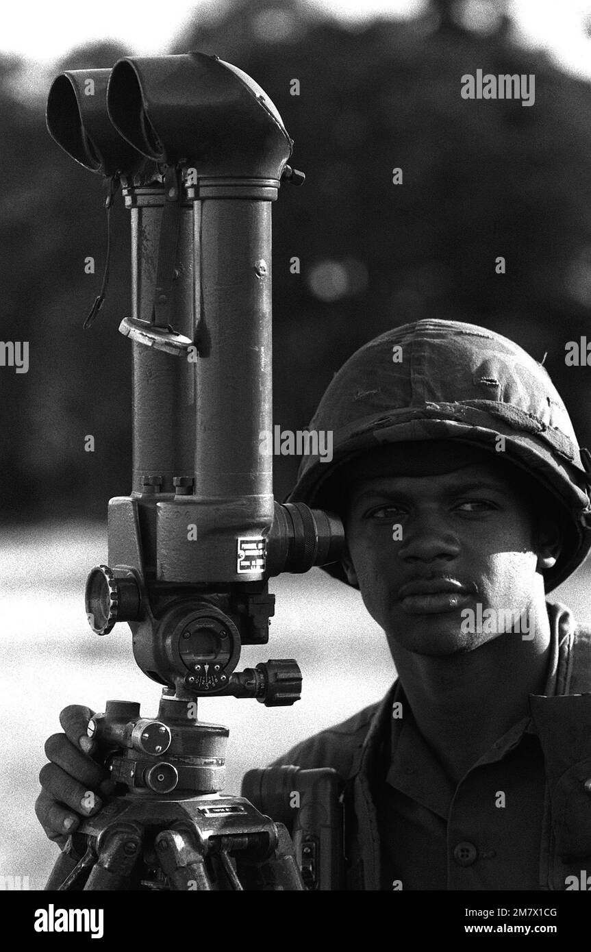 A member of the 9th Division Artillery uses a M-65 battery commanders ...
