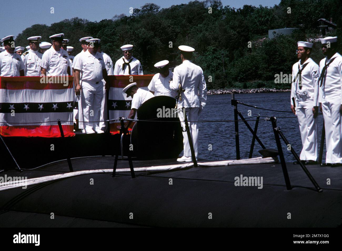 The crew goes aboard the nuclear-powered attack submarine USS BALTIMORE ...