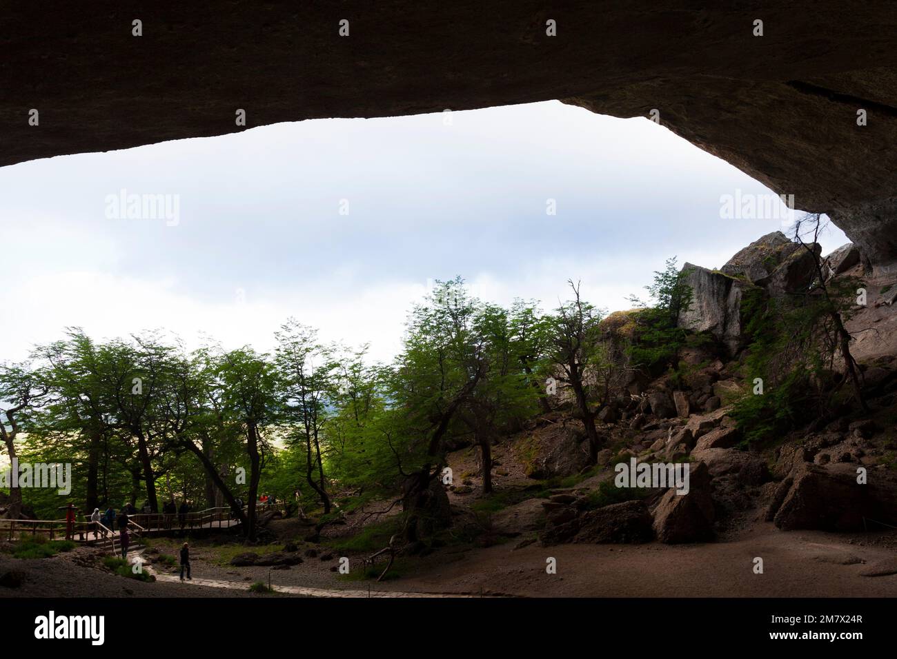 Many tourists visiting the Milodon Bear cove in Las Torres del Paine ...