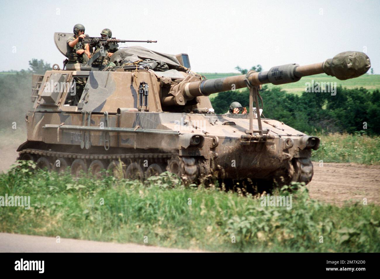 An M-110E1 8-inch self-propelled howitzer on maneuvers during Exercise ...