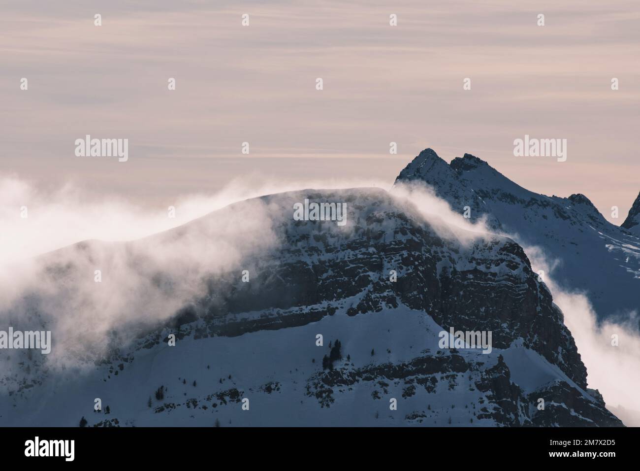 A mesmerizing view of snow-capped mountains in the Alps in winter ...