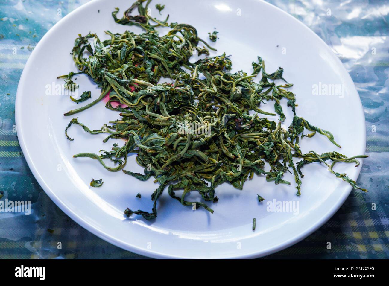 Kenyan Tea green leaves cooking drying up processing traditional way ...