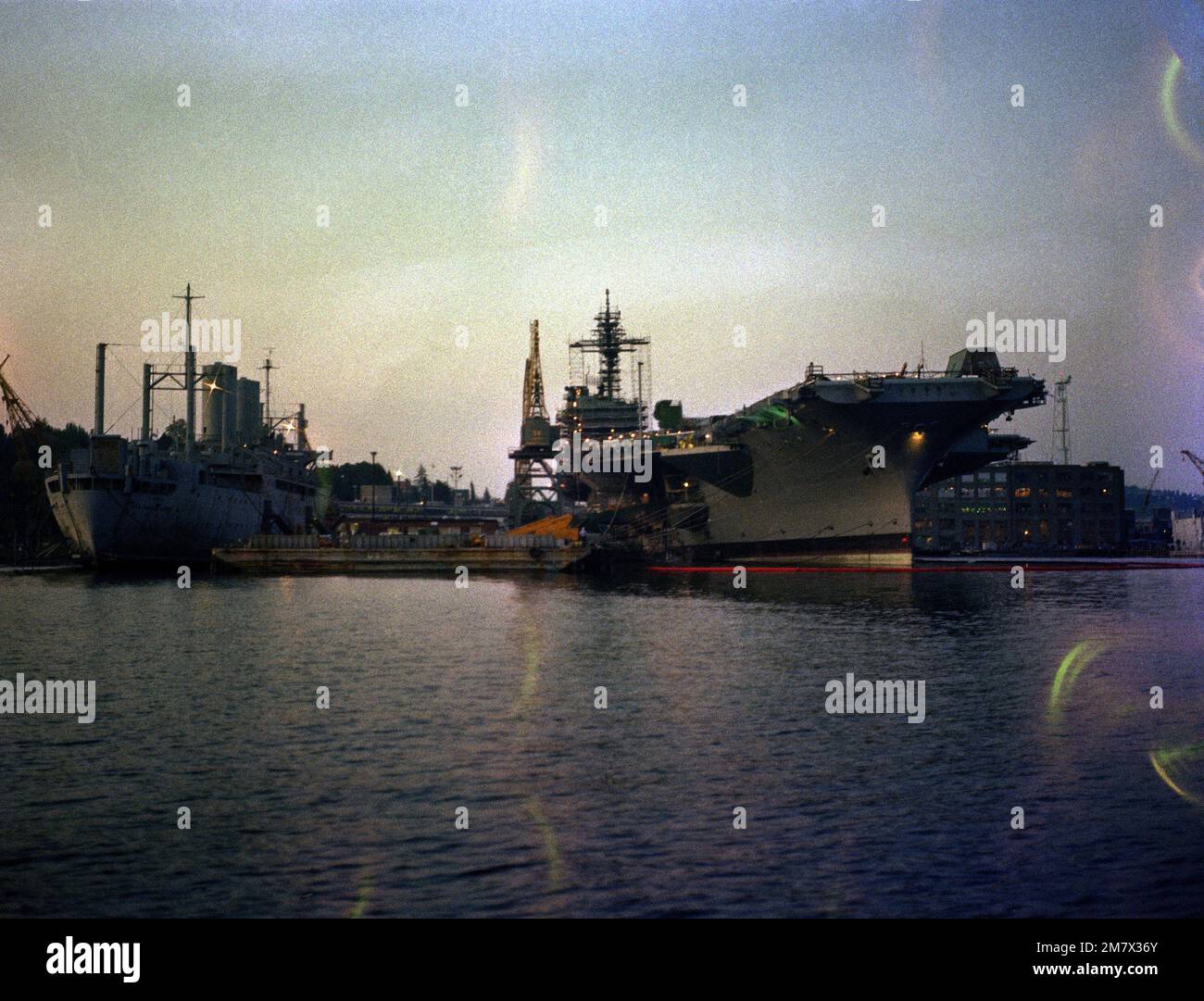 A starboard bow view of the aircraft carrier USS KITTY HAWK (CV 63 ...
