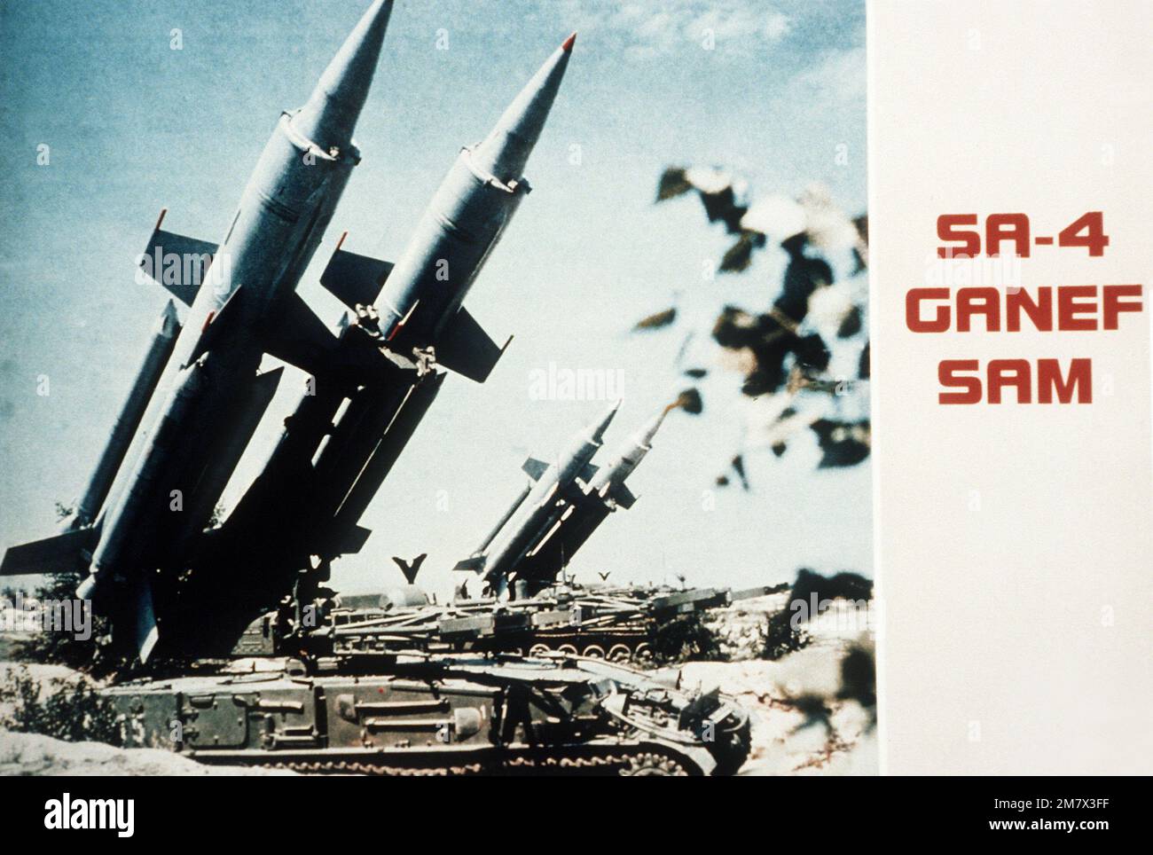 A side view of four SA-4 Ganef surface-to-air missiles mounted on twin ...