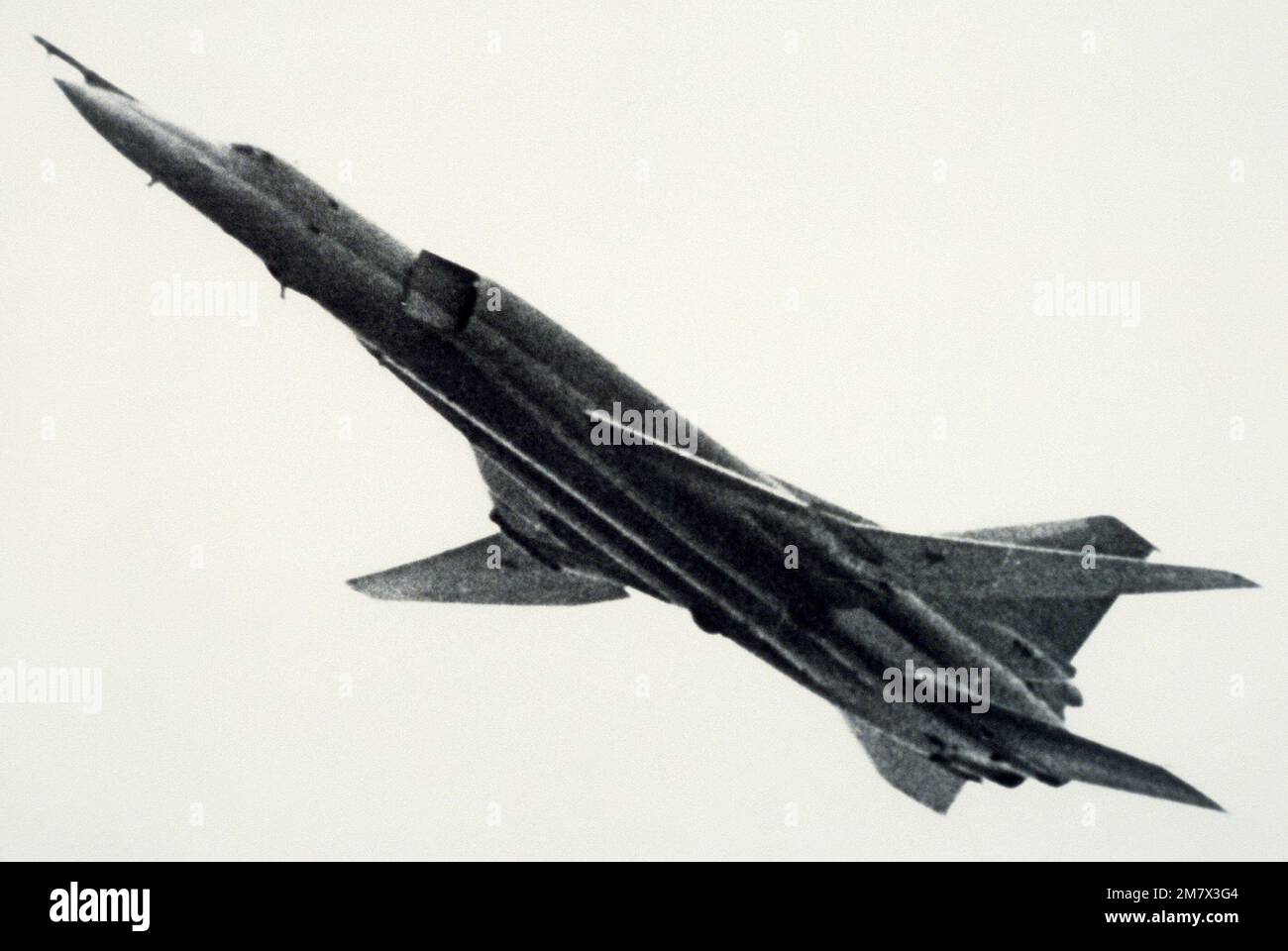 A left side view of a Soviet Tu-22M Backfire aircraft climbing after ...
