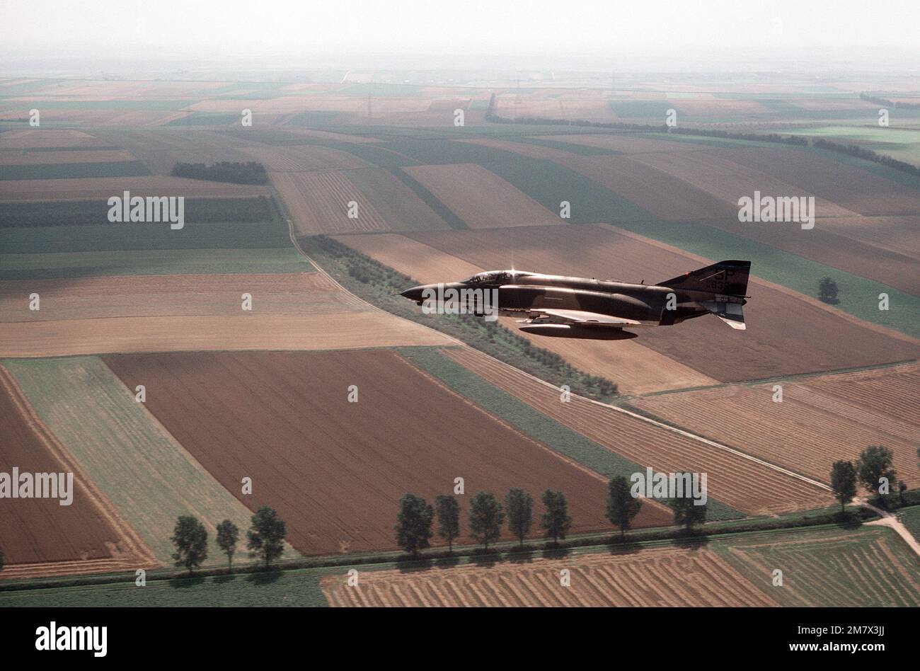 A view of an F-4E Phantom II aircraft carrying an AIM-9 Sidewinder ...