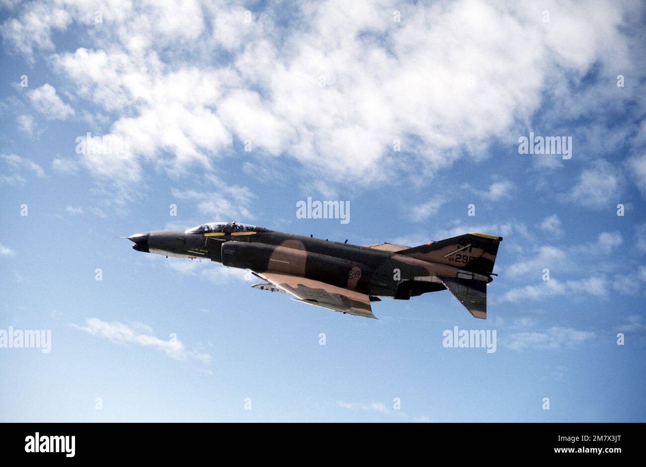 A view of an F-4G Phantom II aircraft banking to the left. The aircraft ...