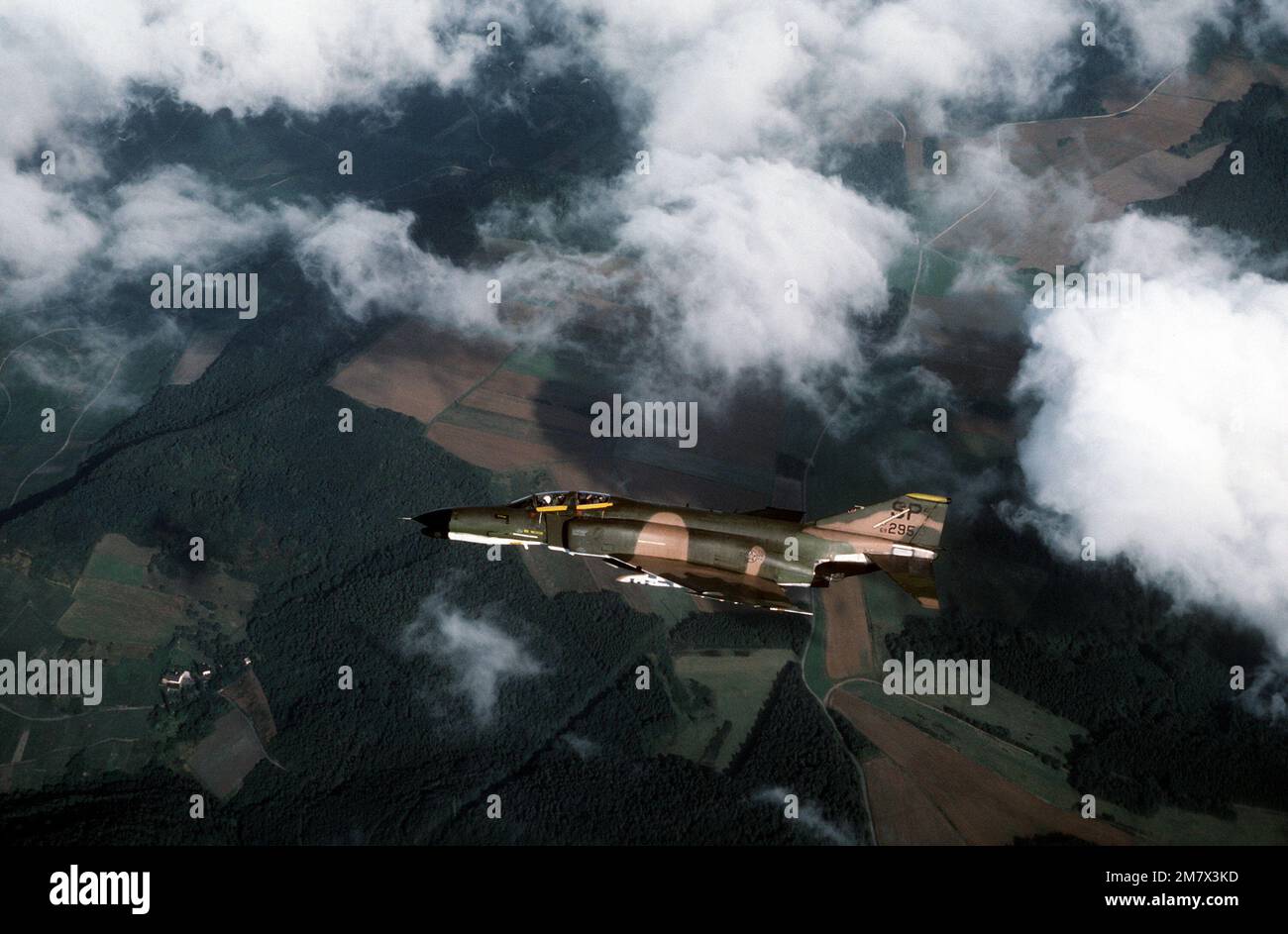 A view of an F-4G Phantom II aircraft banking to the right. The ...