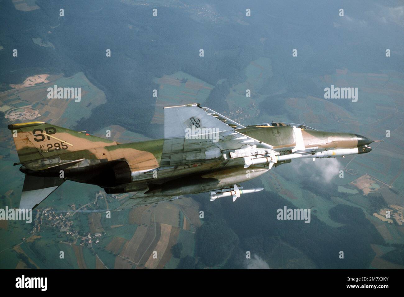 A view of an F-4G Phantom II aircraft banking to the left. The aircraft ...