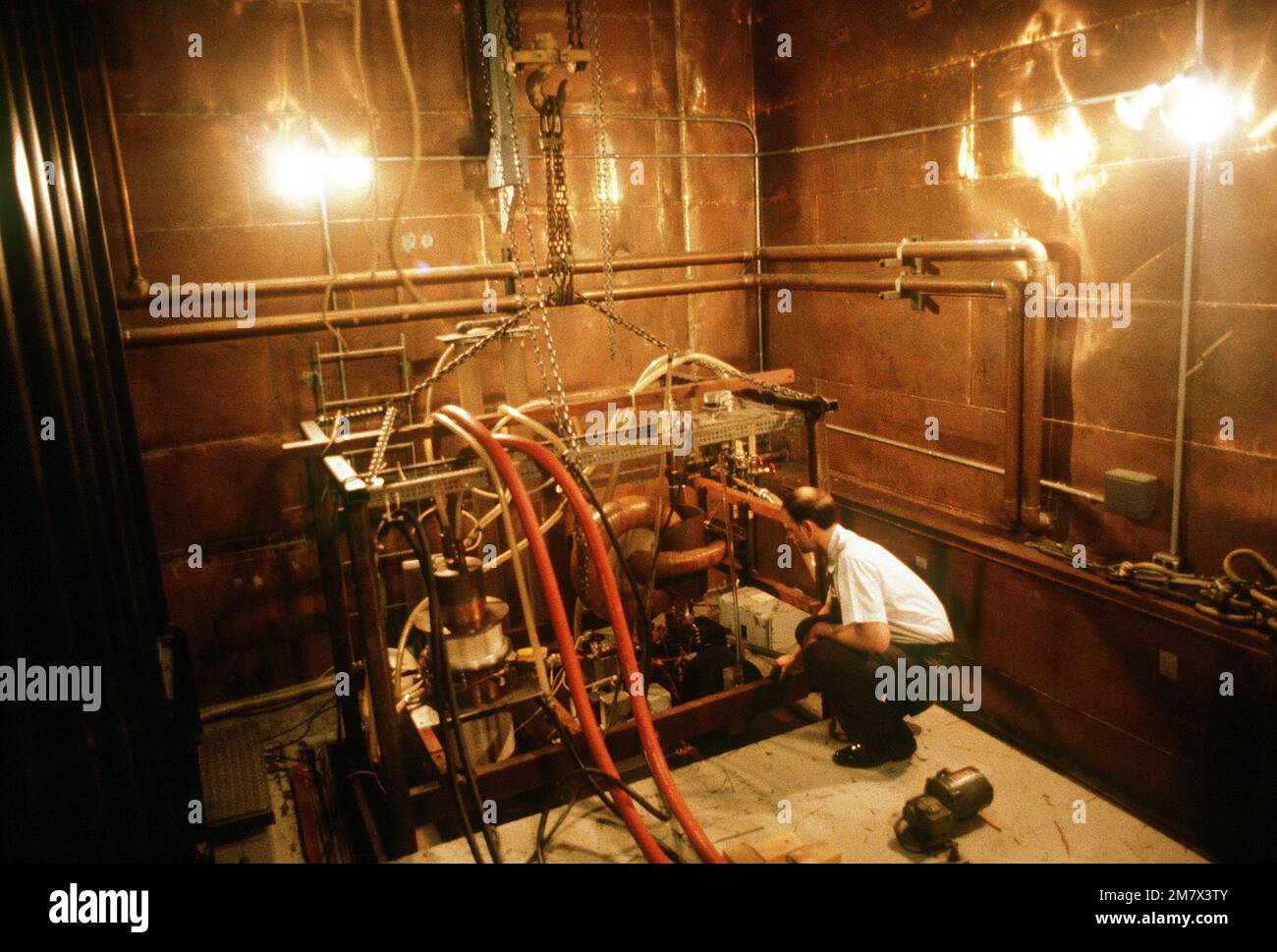 CPT Kevin O'Brian checks a test setup in the high-power laboratory at ...