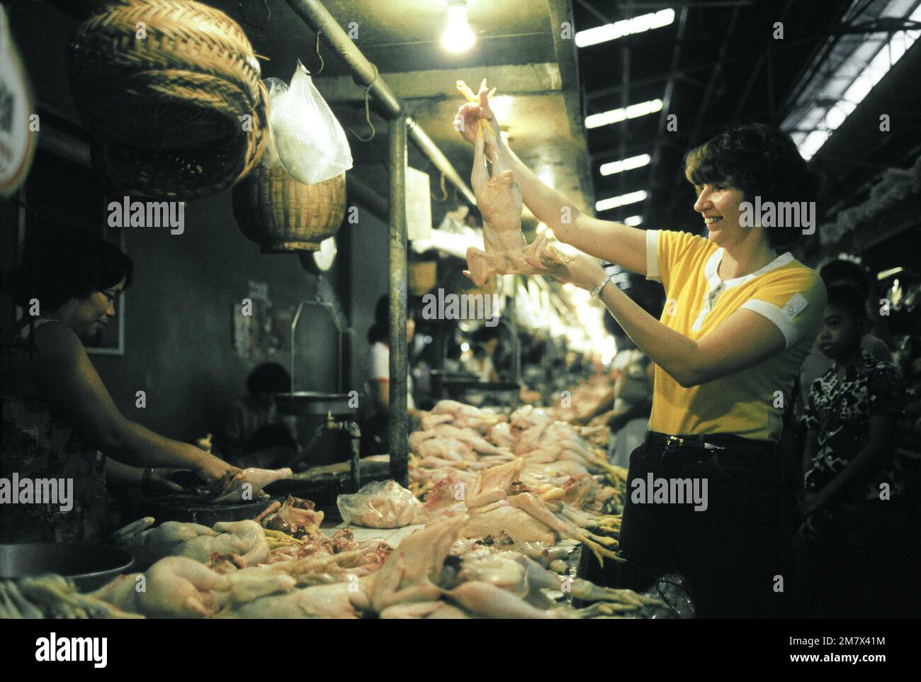 A dependent wife of a crewman from the guided missile cruiser USS ...