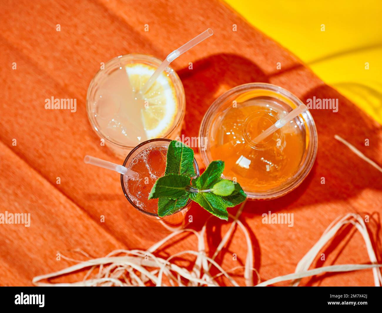 Lemon Orange Citrus Lemonade Cocktail drinks on orange background with ...