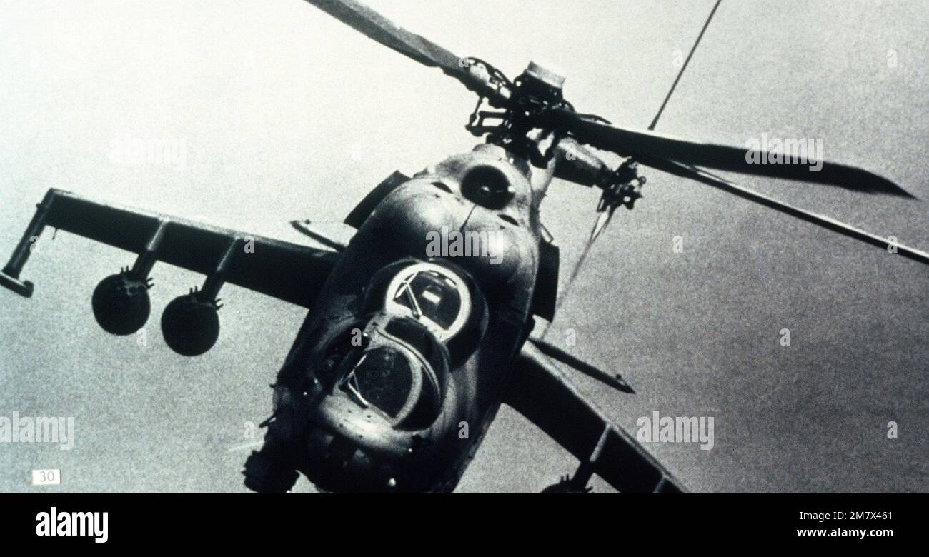Mi-24/Hind-E helicopter with tube-launched anti-tank guided missiles. Country: Unknown Stock ...