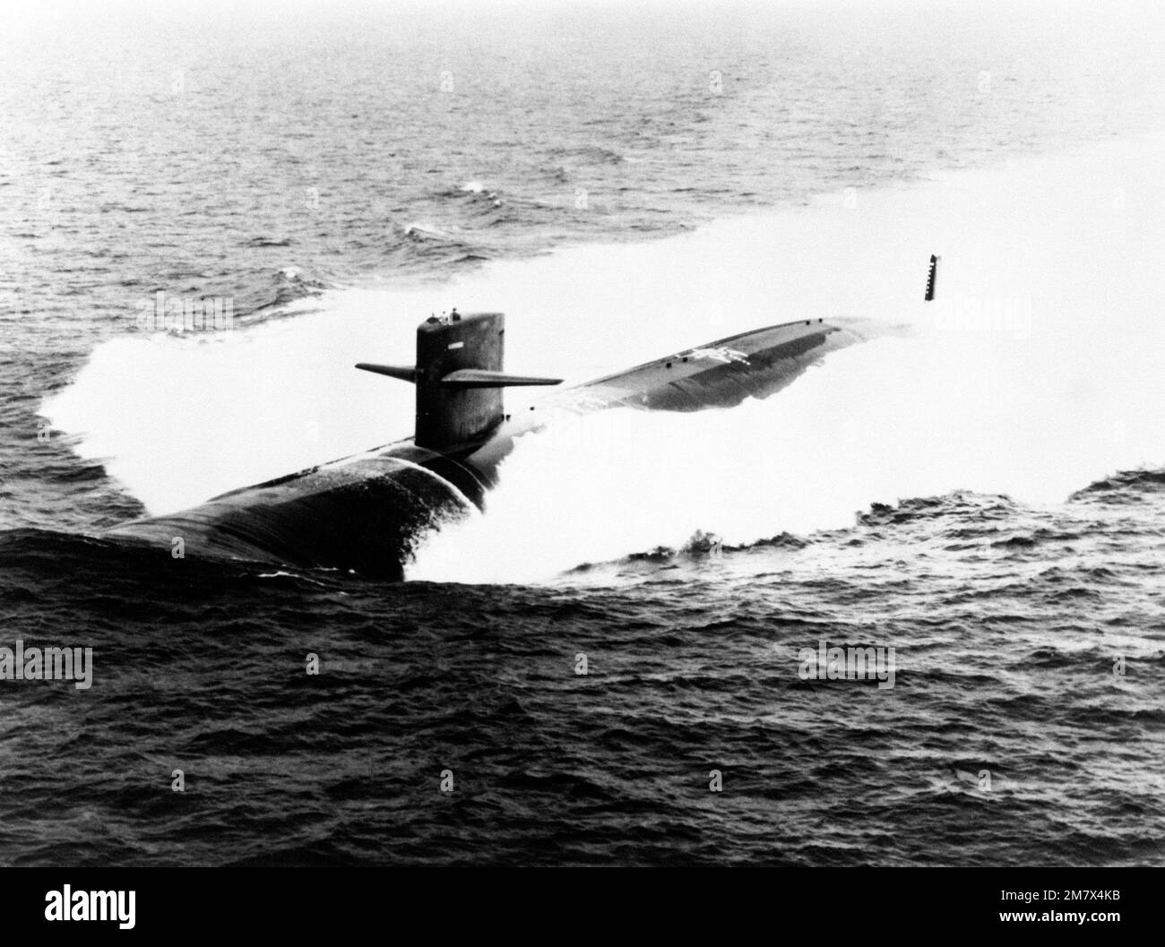 A port bow view of the nuclear-powered attack submarine USS BALTIMORE (SSN-704) underway ...