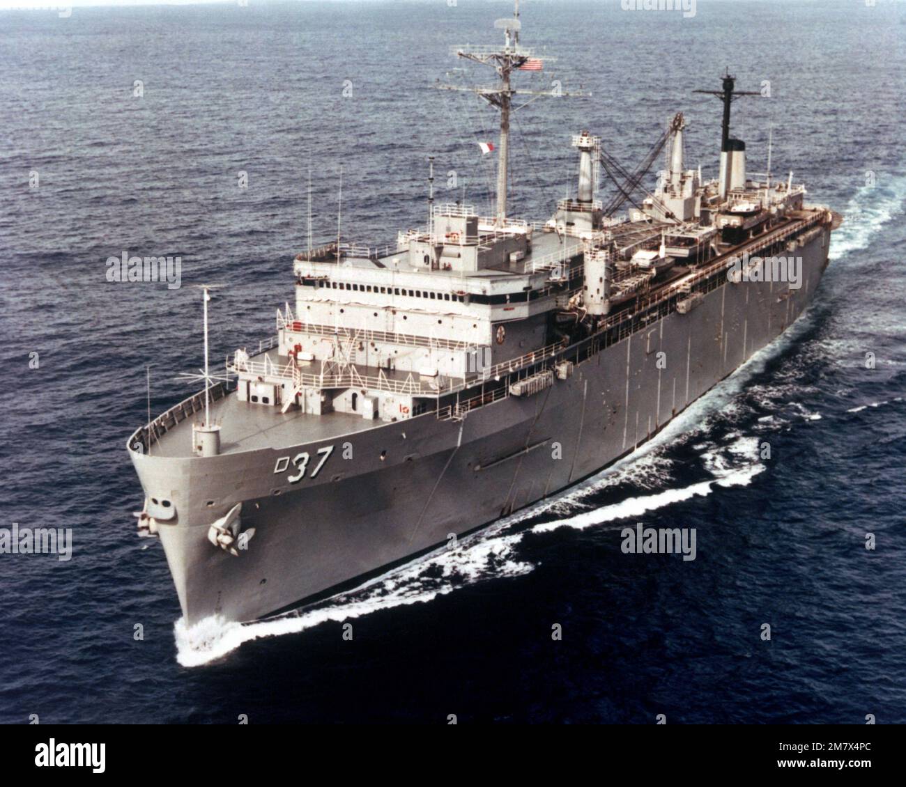 An aerial port bow view of the destroyer tender USS SAMUEL GOMPERS (AD ...