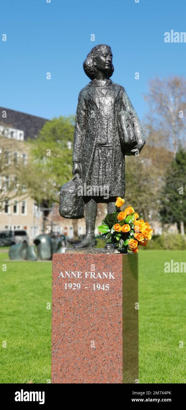 A vertical shot of Anne Frank Statue at the Merwede Square in Amsterdam ...