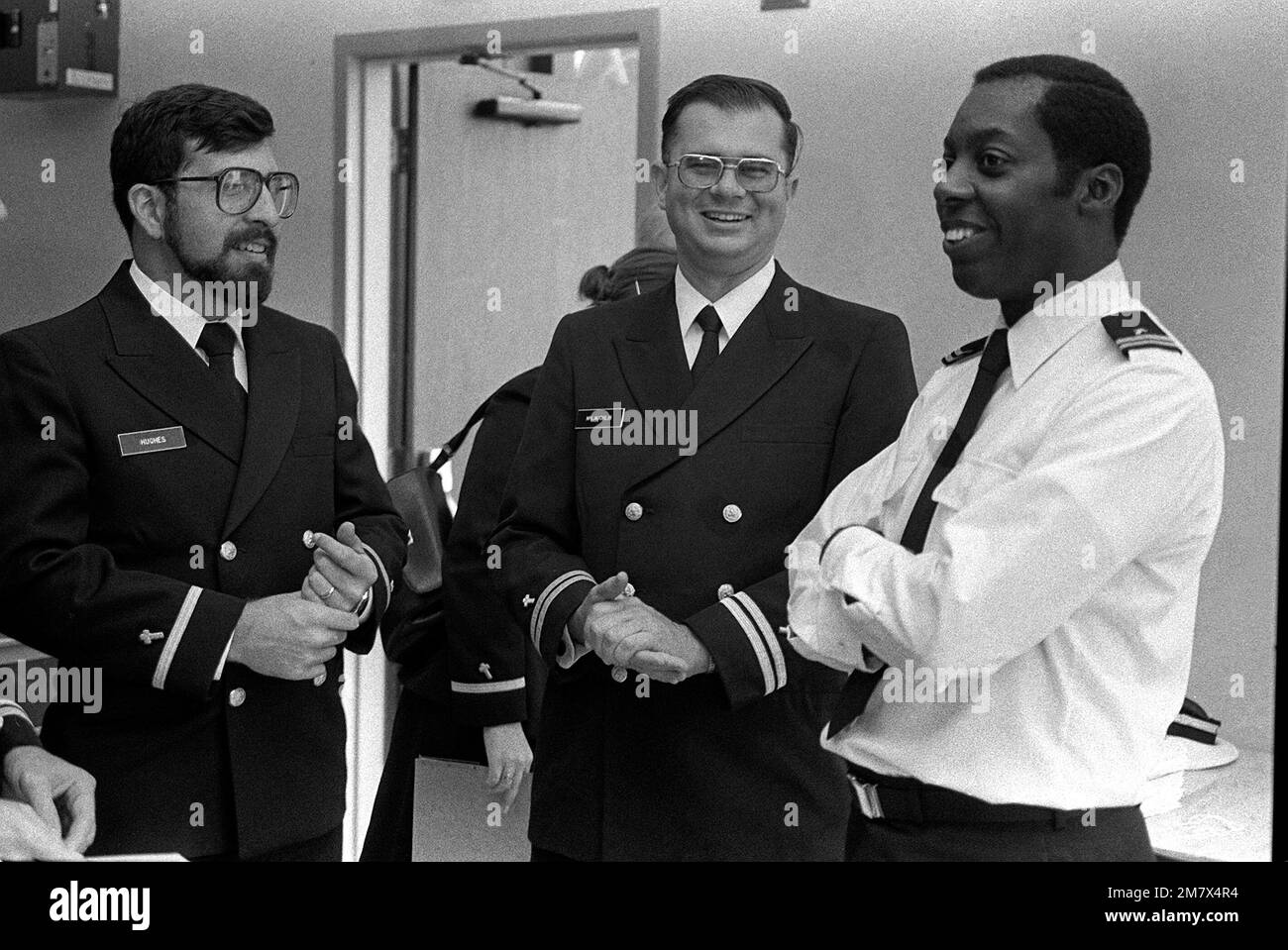 LT. Leslie Branch talks with other chaplains prior to his commissioning ...