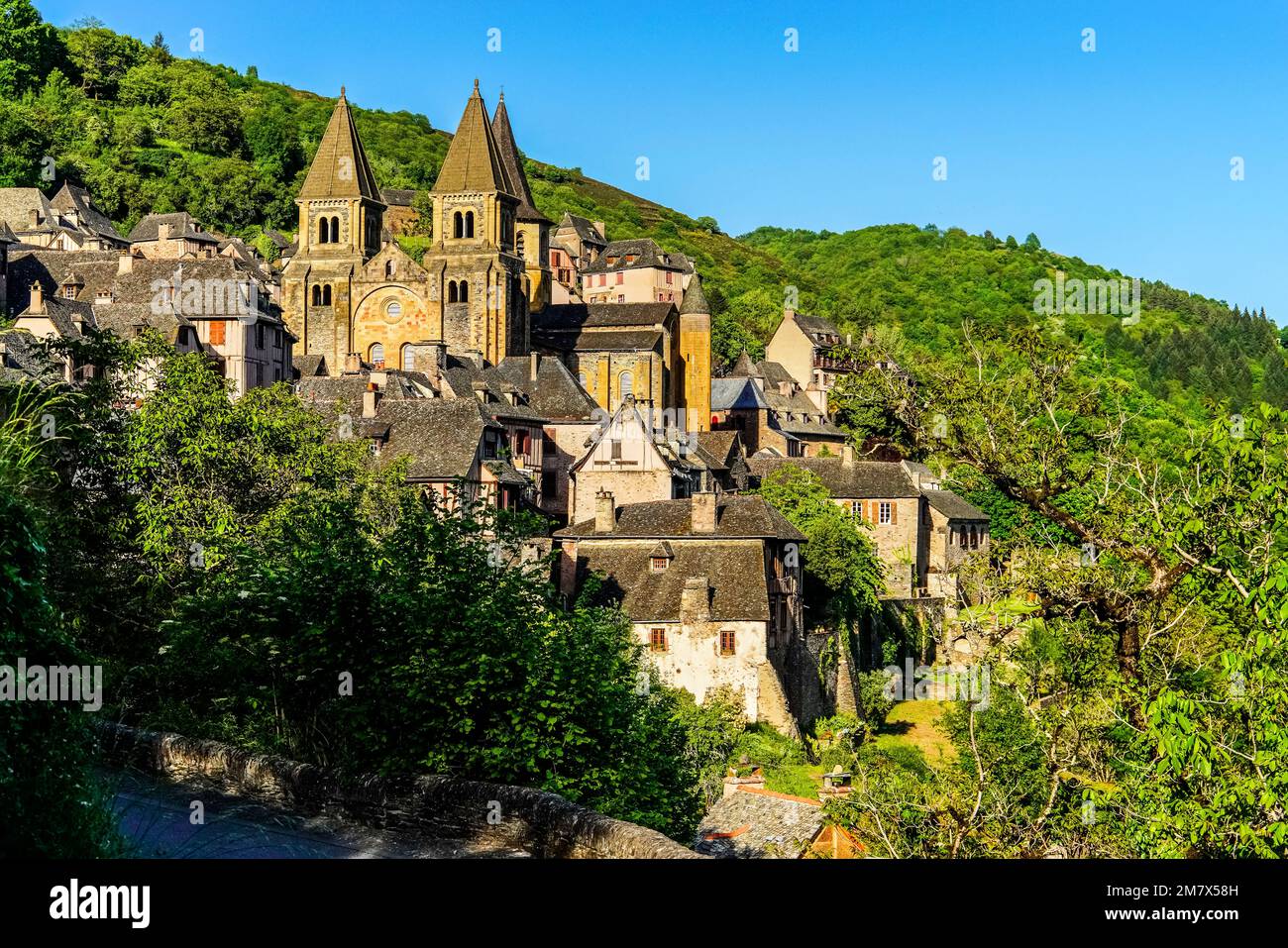 Beautiful hillside view of medieval hillside village of Conques; France ...