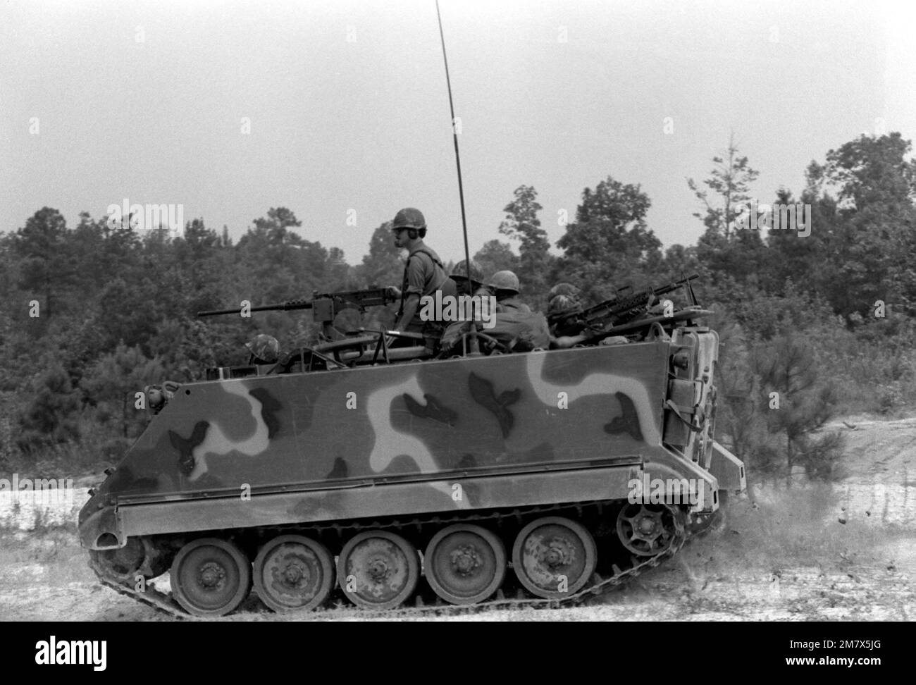 A left side view of an M-113 armored personnel carrier during training ...