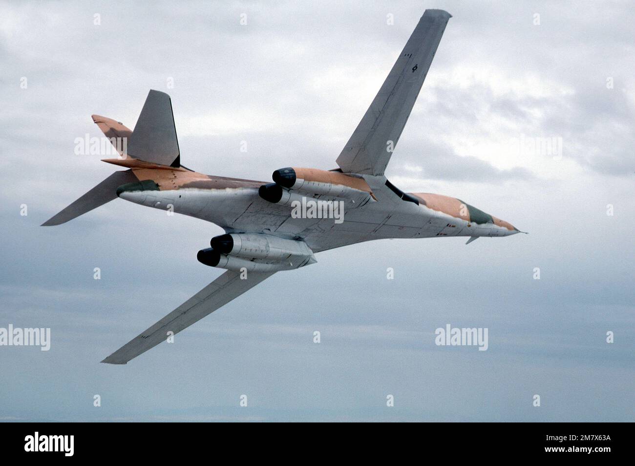 A right underside view of a B-1 bomber aircraft on its first flight ...