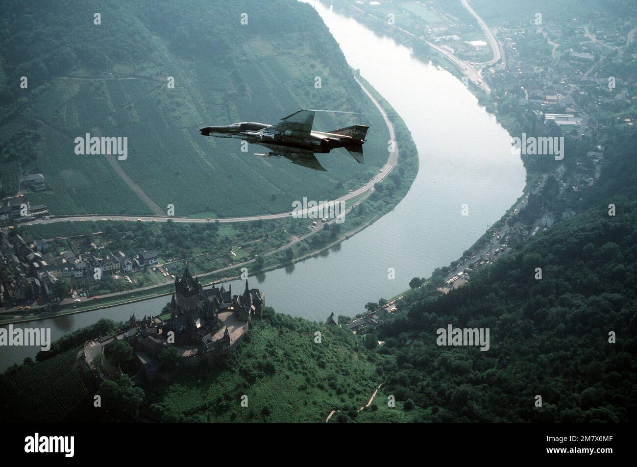 An air-to-air left side view of an F-4G Phantom II Wild Weasel aircraft ...