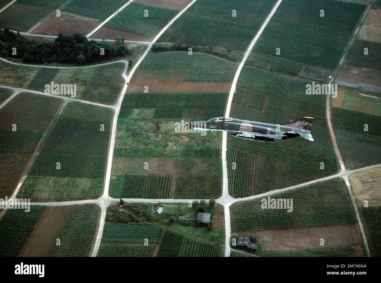 An air-to-air left side view of an F-4G Phantom II Wild Weasel aircraft ...
