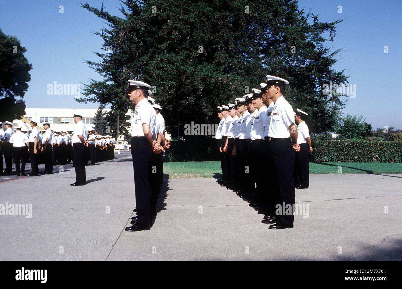 Side view of Navy personnel waiting to be inspected. Base: Naval Air ...