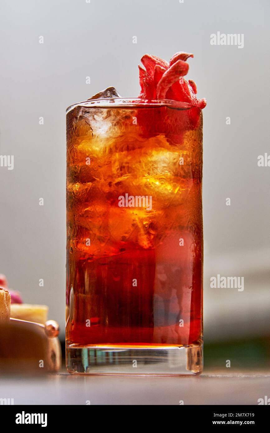 Sunny Red orange Alcohol cocktail drink on background Stock Photo - Alamy