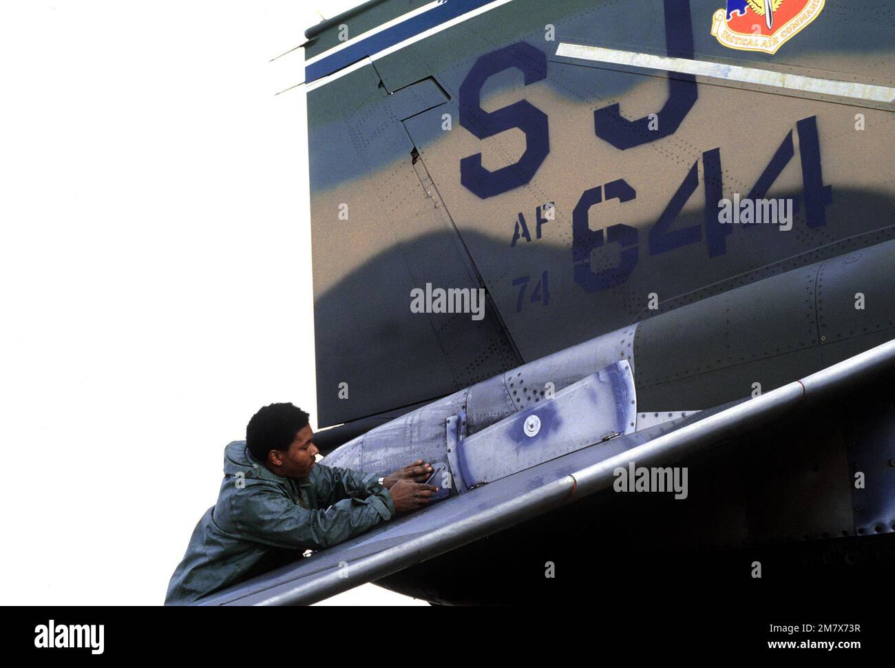 SSGT Willard Green performs a post flight inspection of an F-4E Phantom ...