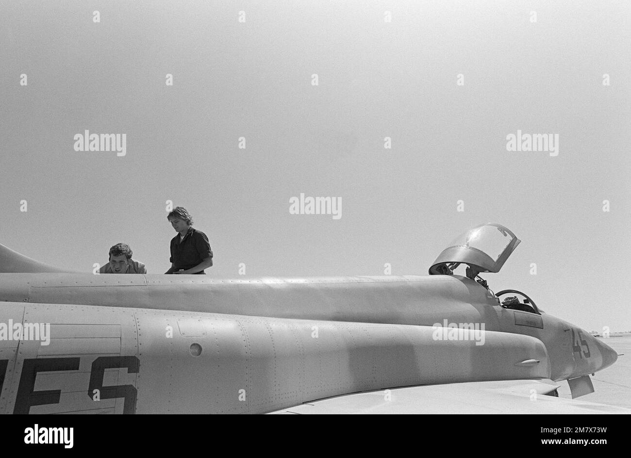 Maintenance personnel prepare a Navy Fighter Weapons School F-5E Tiger ...
