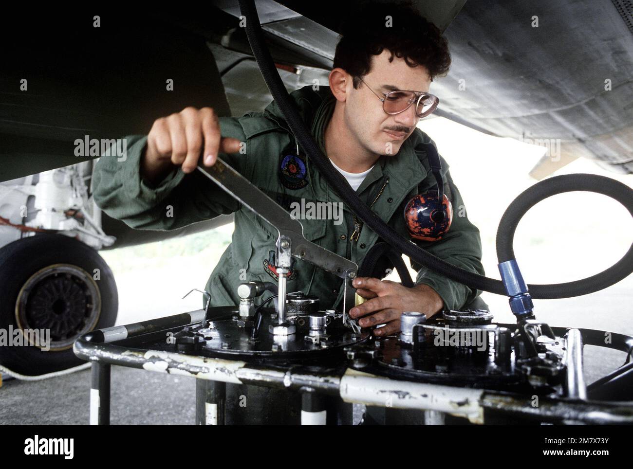 A1C Thomas Smith performs maintenance on an F-4E Phantom II aircraft ...
