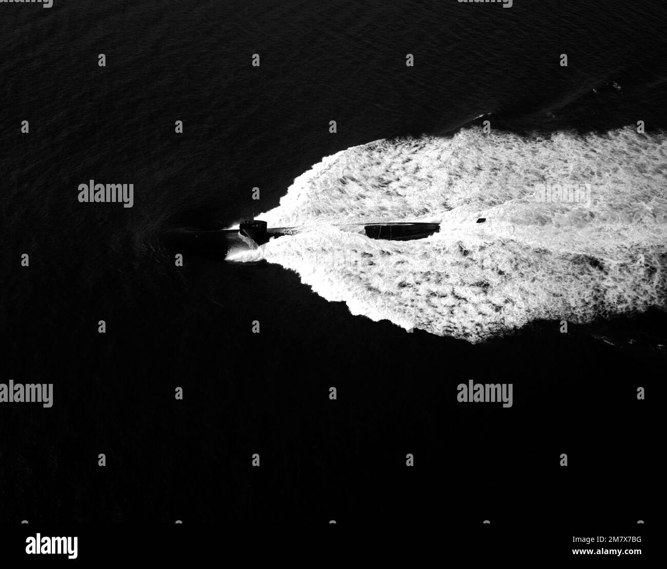 Aerial port beam view of the nuclear-powered attack submarine USS ...
