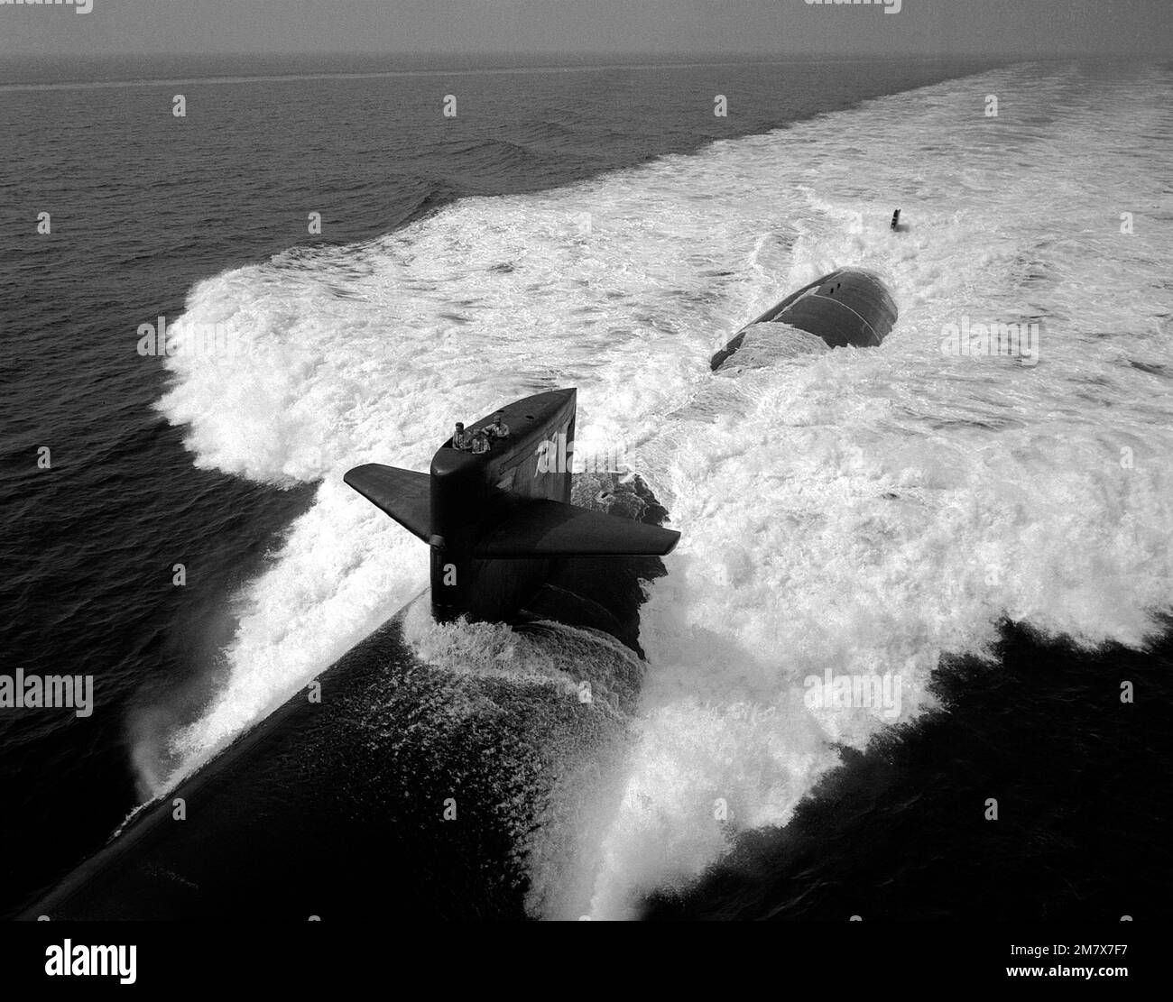 An aerial port bow view of the nuclear-powered attack submarine USS ...