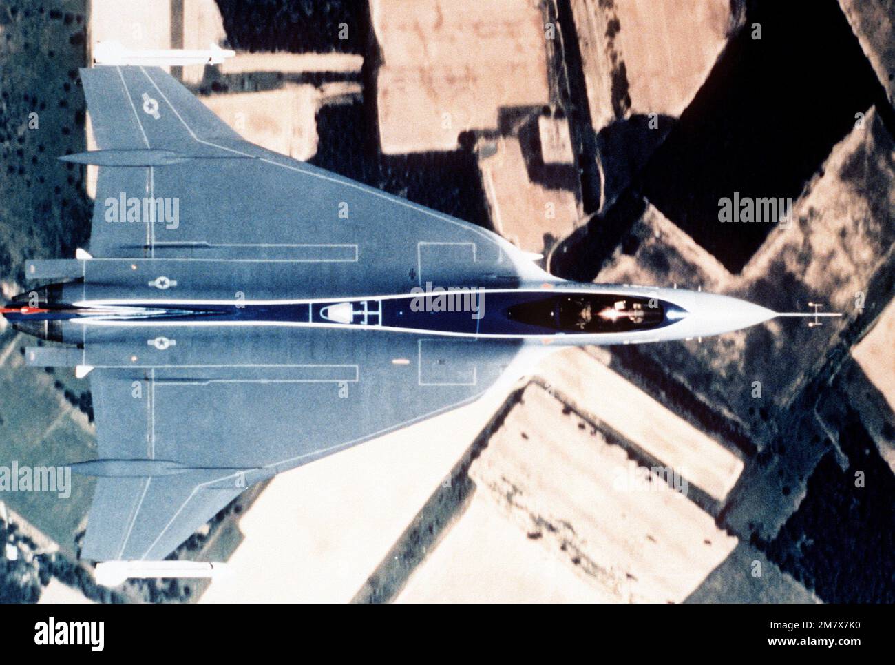 An air-to-air top view of an F-16XL Fighting Falcon aircraft near ...