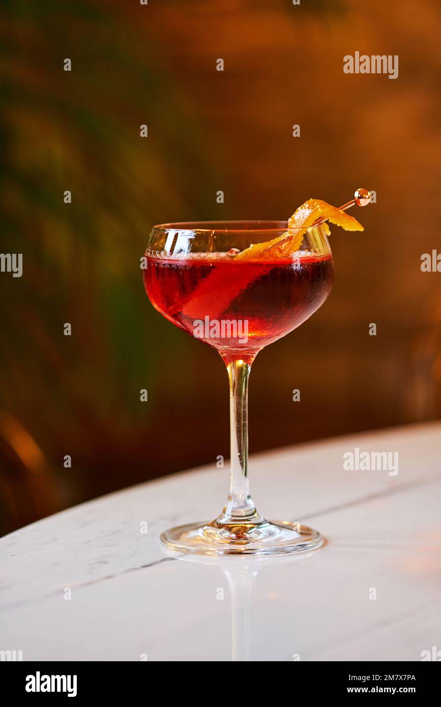 Red Alcohol cocktail drink on table background Stock Photo - Alamy