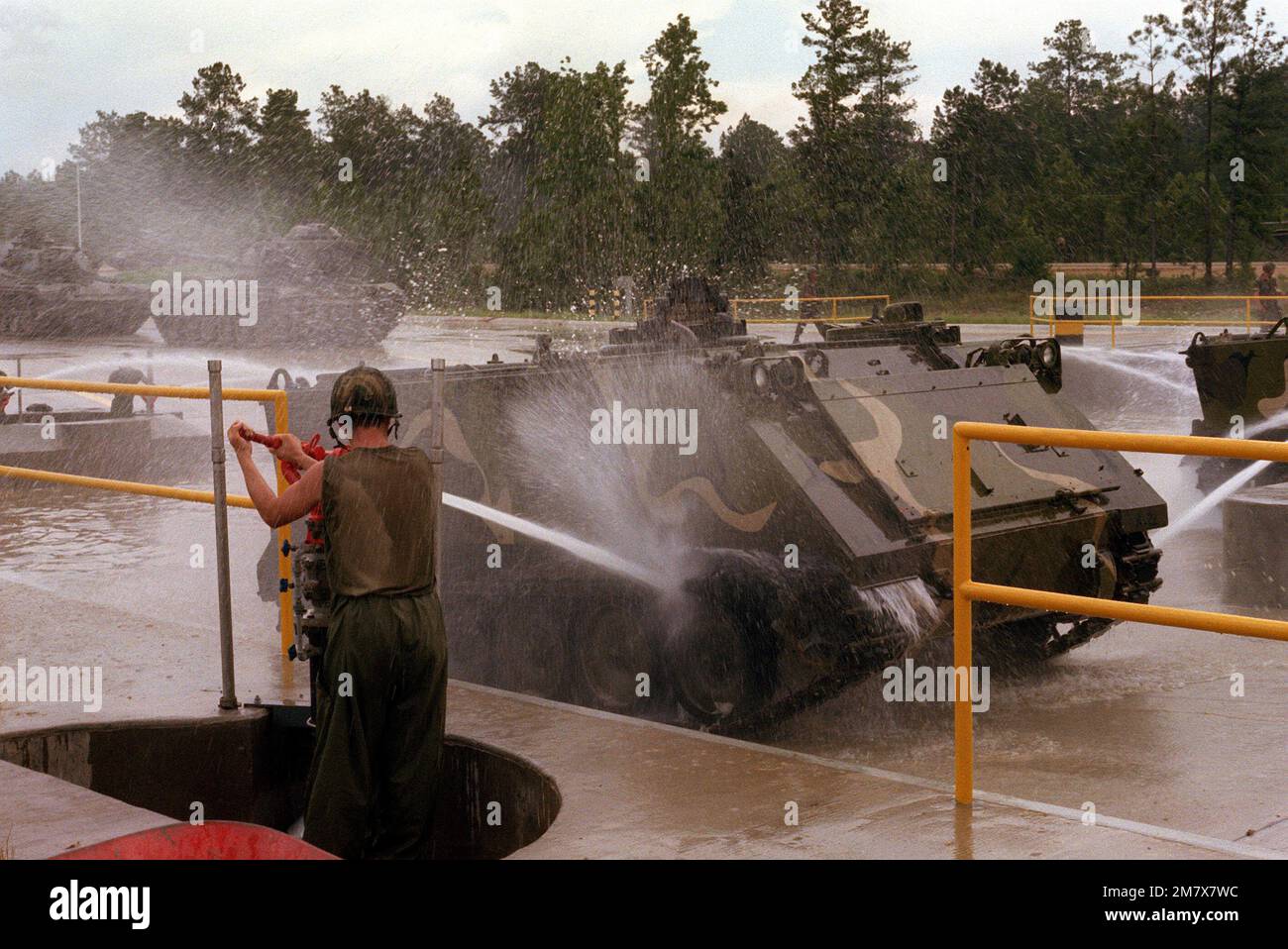 An M-113 armored personnel carriers is washed at the Tank Wash ...