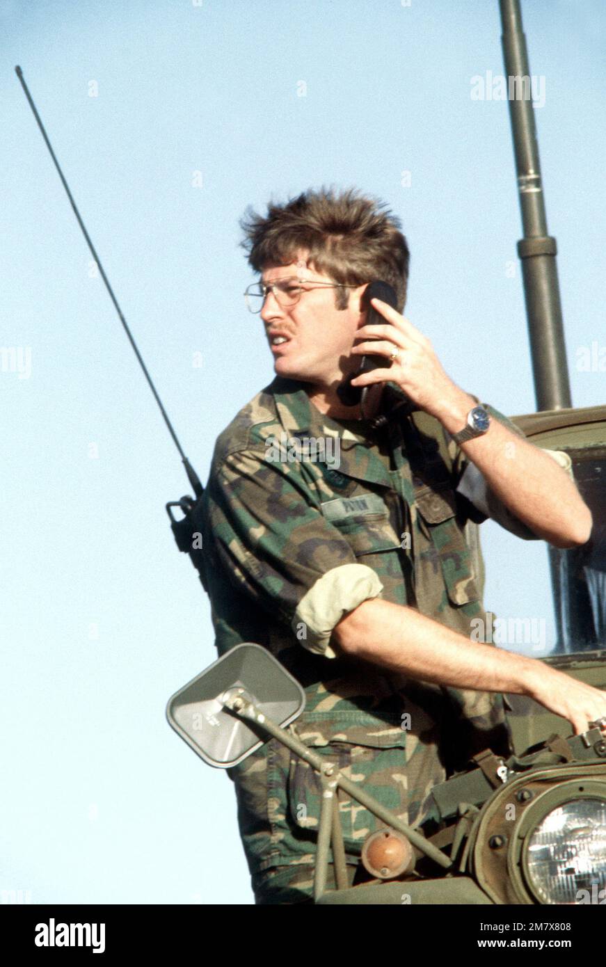 A forward air controller, using a radio, directs an F-4 Phantom II ...